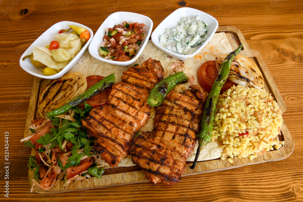 Chicken wings barbeque in a dish with BBQ grill sauce . Izgara tavuk ...