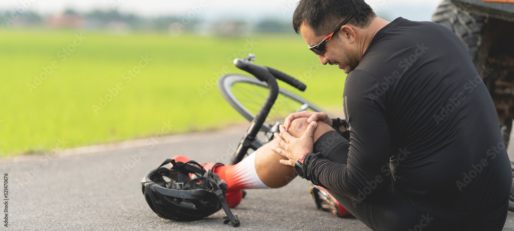 Bike injuries. Man cyclist fell fell off road bike while cycling ...