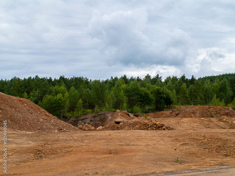 Mystierious cave opening in the distance in an orange post apocalyptic ...