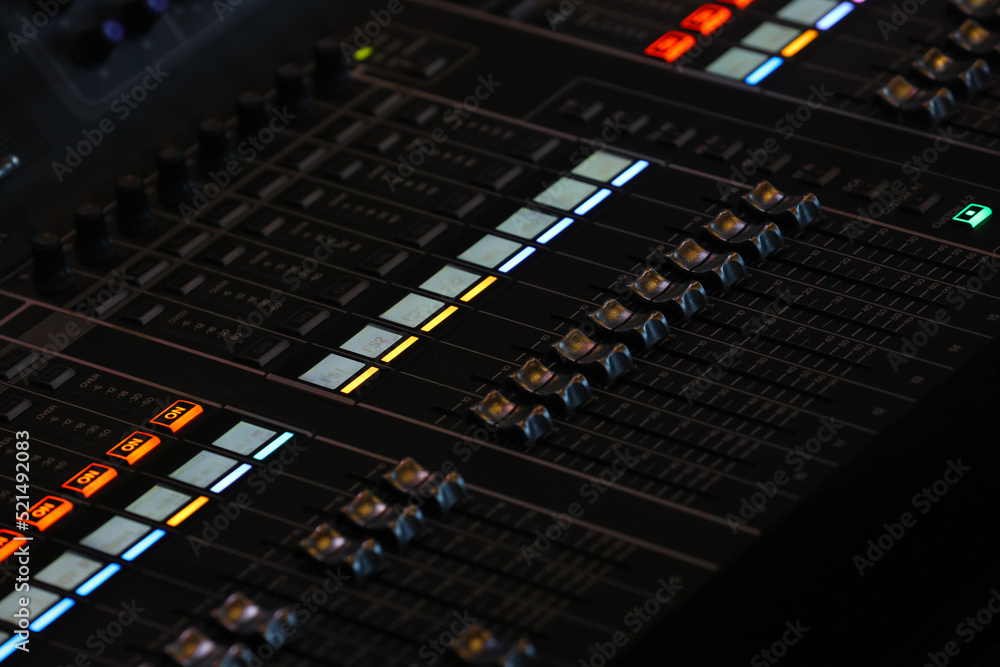 Professional sound and audio mixer control panel with buttons and ...