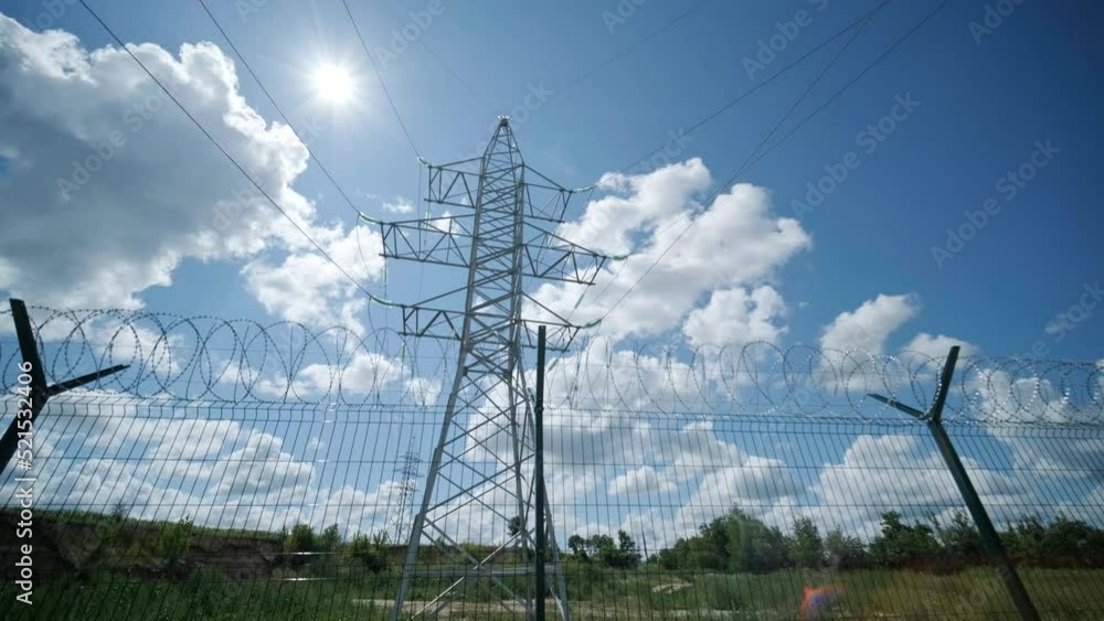 Transmission tower supporting an overhead high voltage power line ...