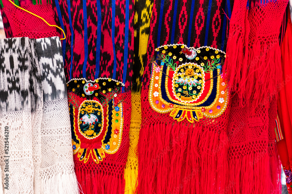 Scarves or makans from Ecuador at the market made using a technique ...