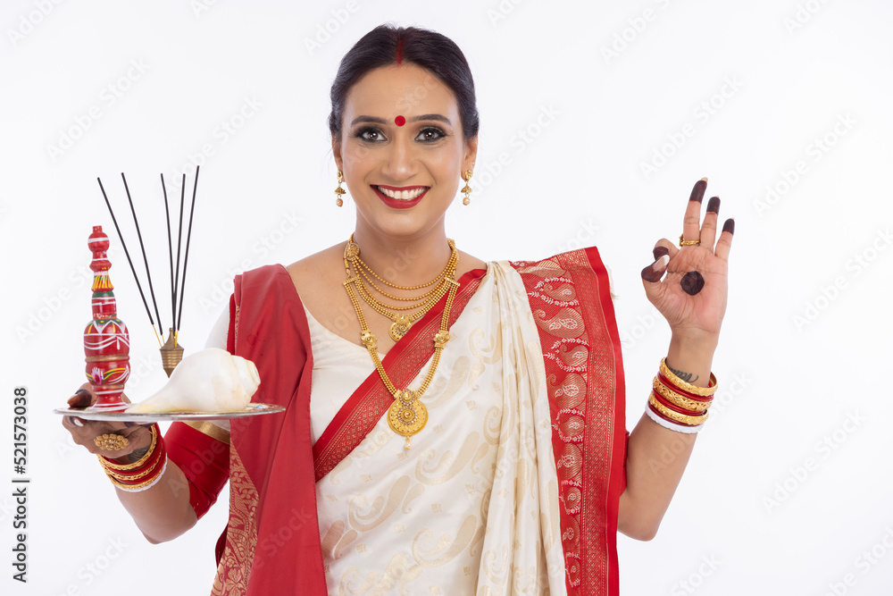 Bengali woman with puja thali. Stock Photo | Adobe Stock