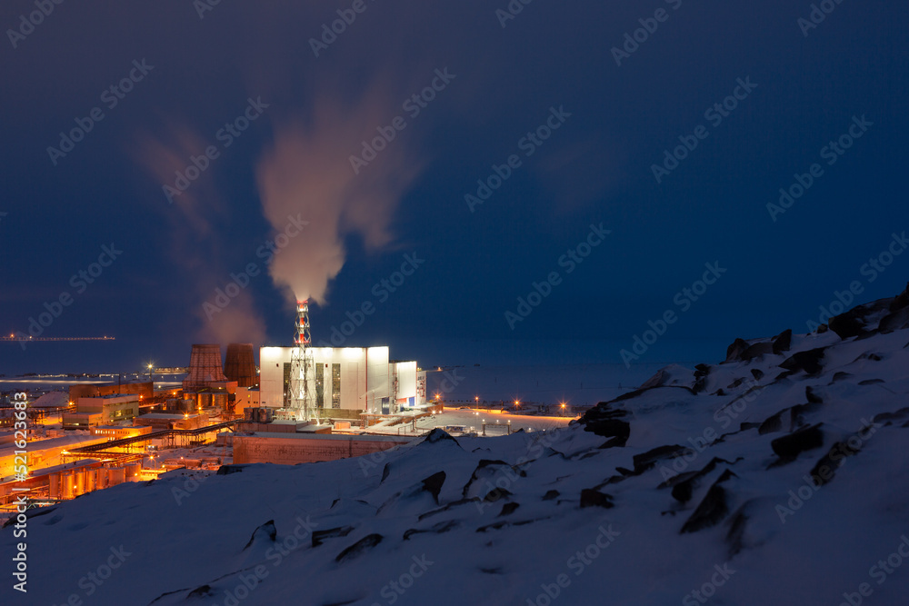 Winter night view of the thermal power plant. Electric power industry ...