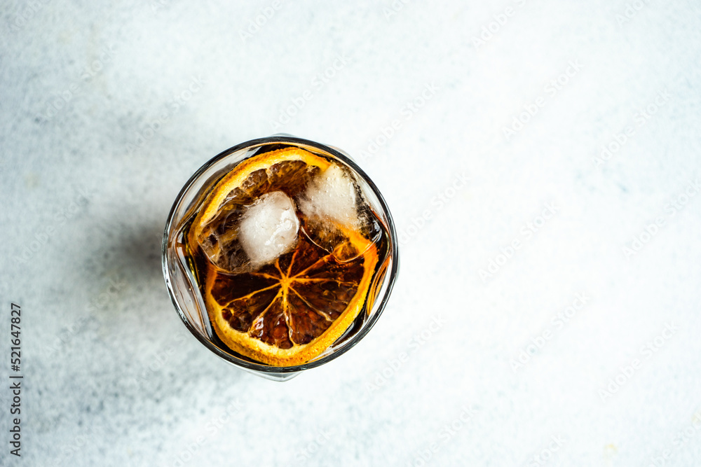 Overhead view of a cola drink with ice cubes and slices of orange Stock ...