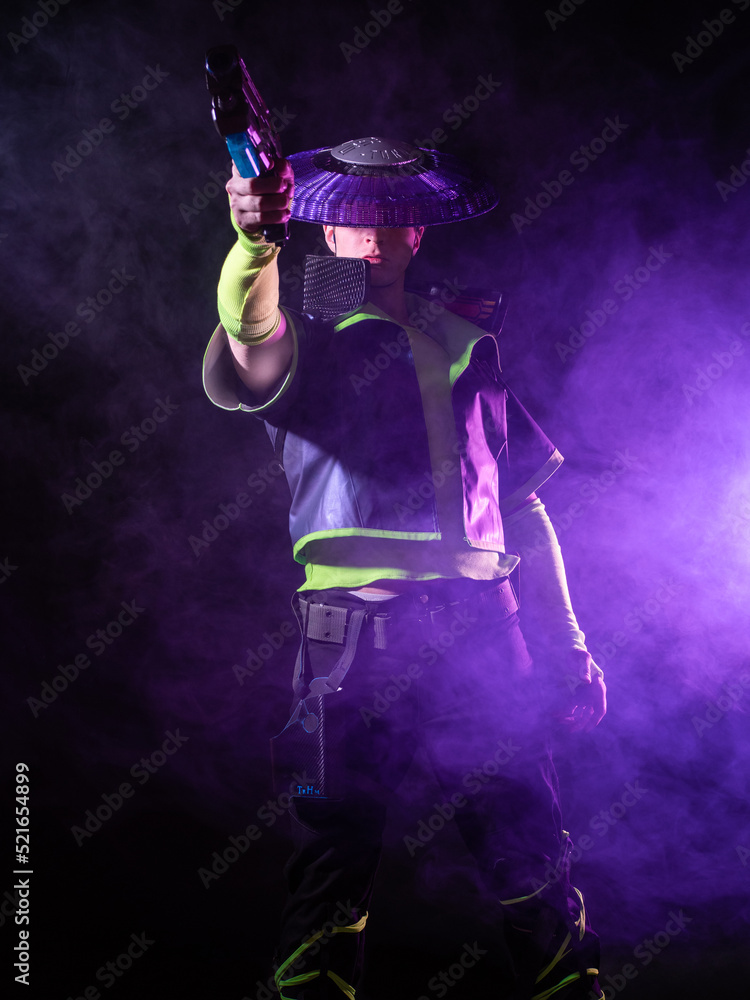 Cyborg killer in an Asian hat, a futuristic character with a gun in his ...