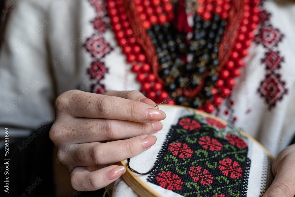 A girl embroiders a traditional Ukrainian vyshyvanka pattern Stock ...