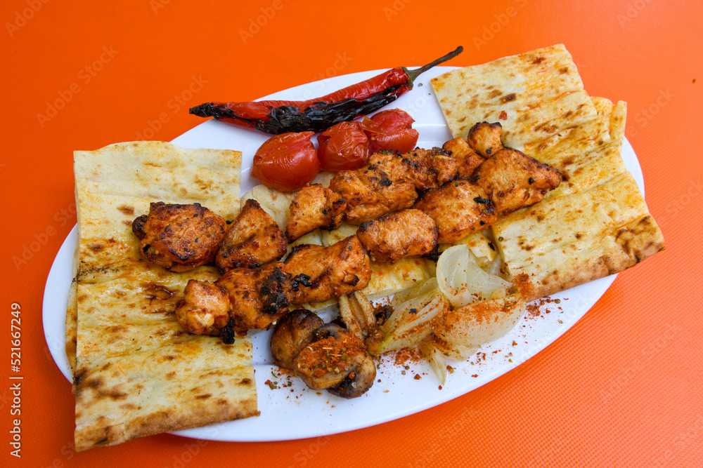 Chicken wings barbeque in a dish with BBQ grill sauce . Izgara tavuk ...