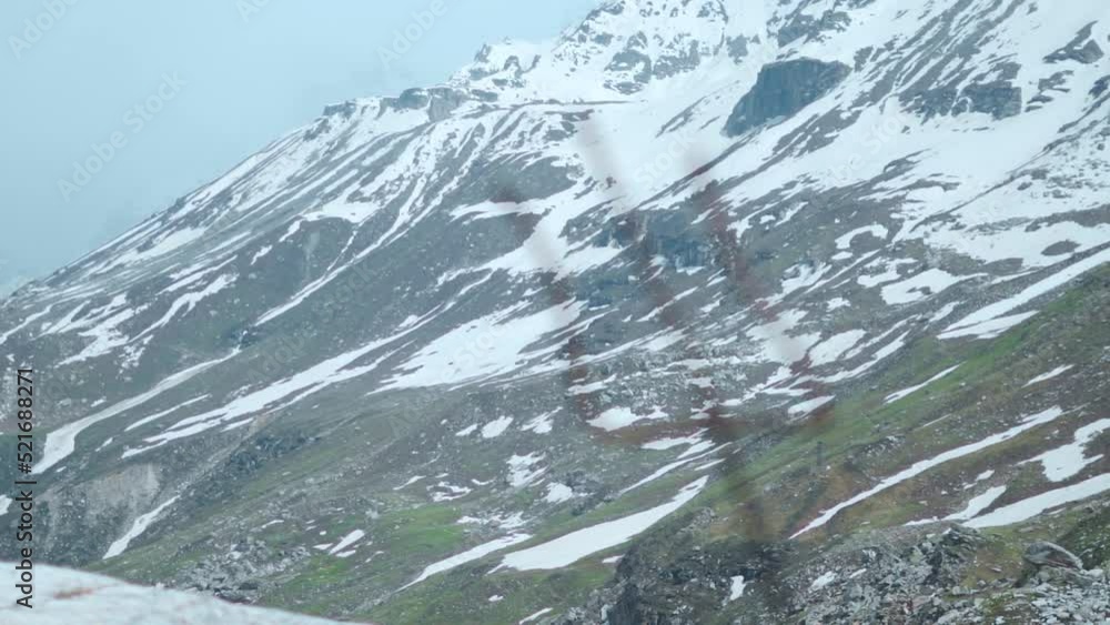Defocused Shiva Trishul in background of snow covered Himalaya ...