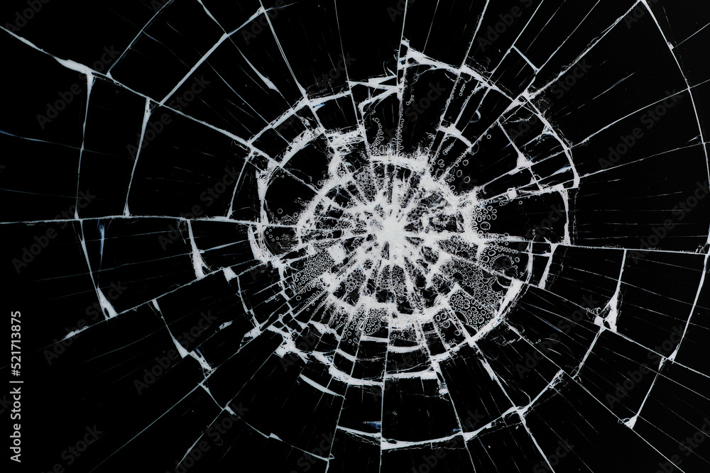cracks on the glass impact on the glass, abstract background broken ...