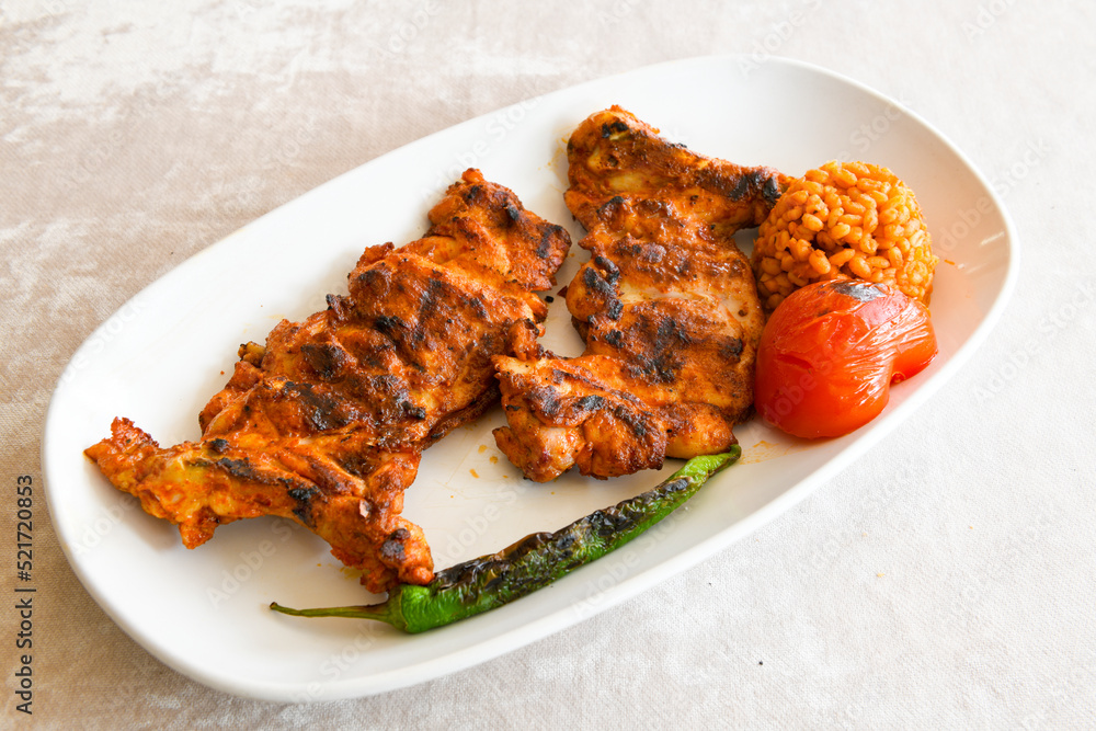 Chicken wings barbeque in a dish with BBQ grill sauce . Izgara tavuk ...