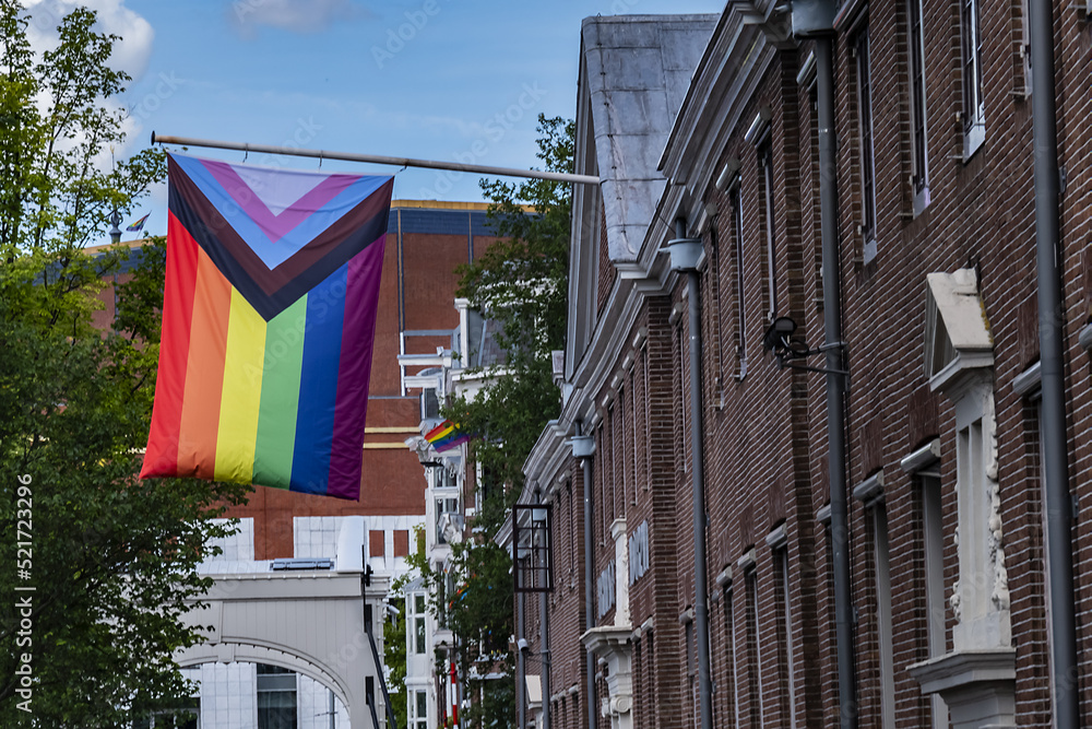 Celebration of pride month in Amsterdam: Rainbow flag hanging outside a ...