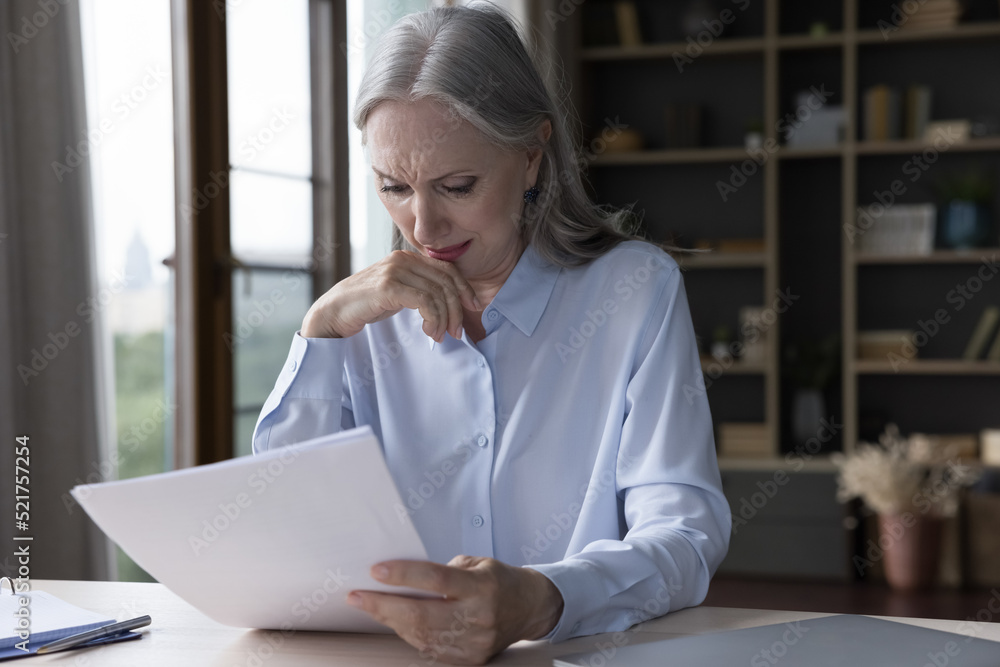 Sad unhappy elderly business woman receiving bad shocking news about ...