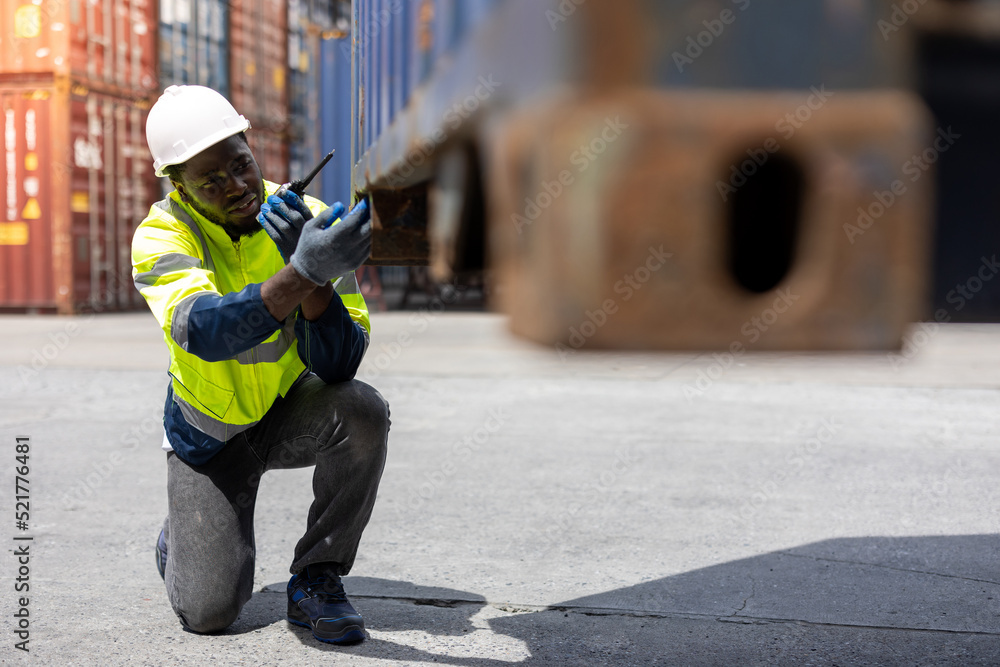 Container worker is doing his daily routine operation in the container ...