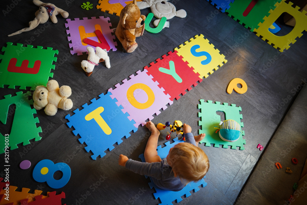 bird view of colorful kids puzzle mat playground in nursery or at home ...
