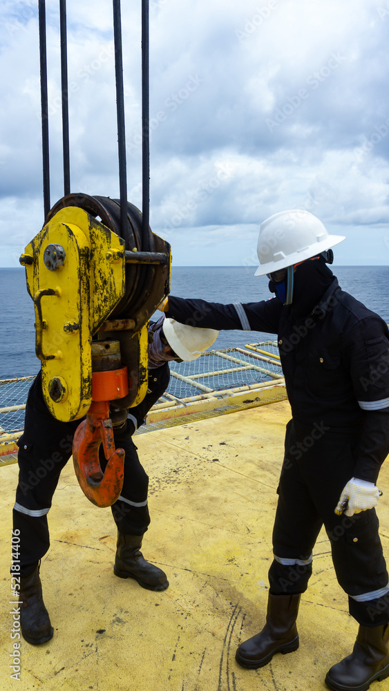 Mechanical engineer inspector is inspecting lifting equipment of ...