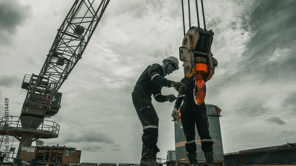 Mechanical engineer inspector is inspecting lifting equipment of ...
