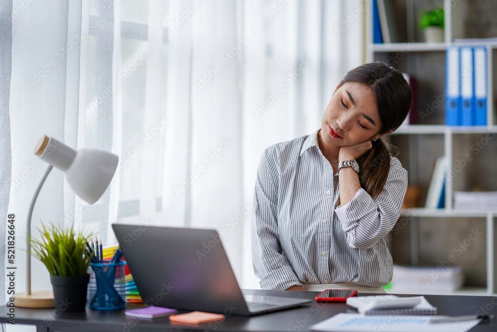 Attractive Asian business woman Relax from work after sitting for a ...