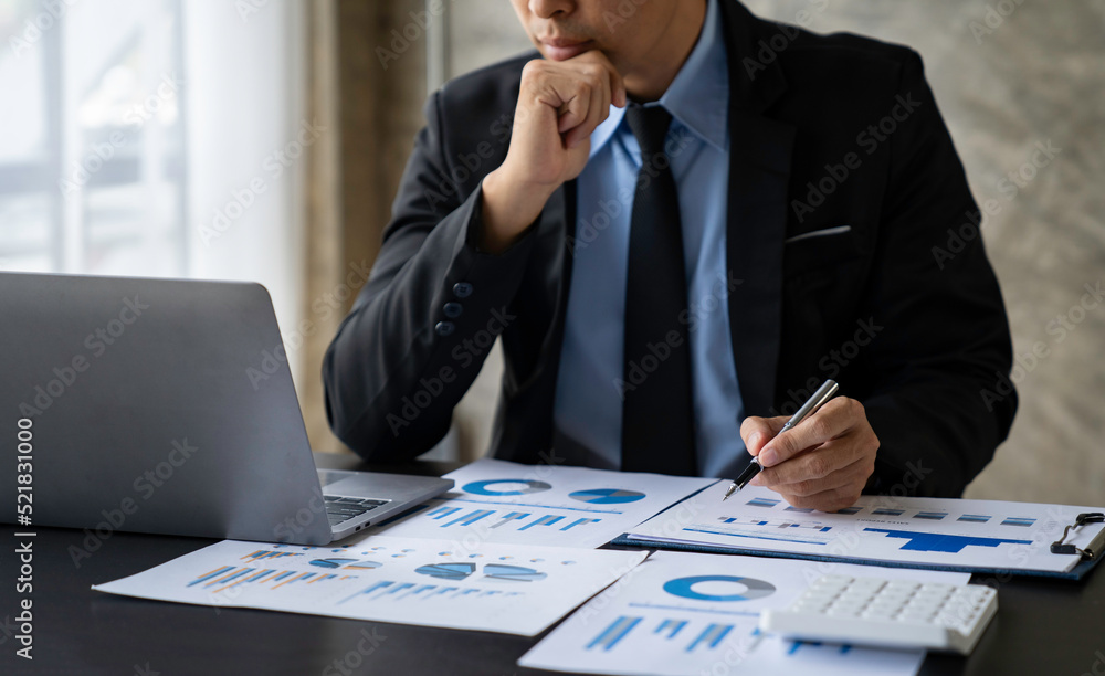 Asian male finance staff Is explaining the performance from the company ...