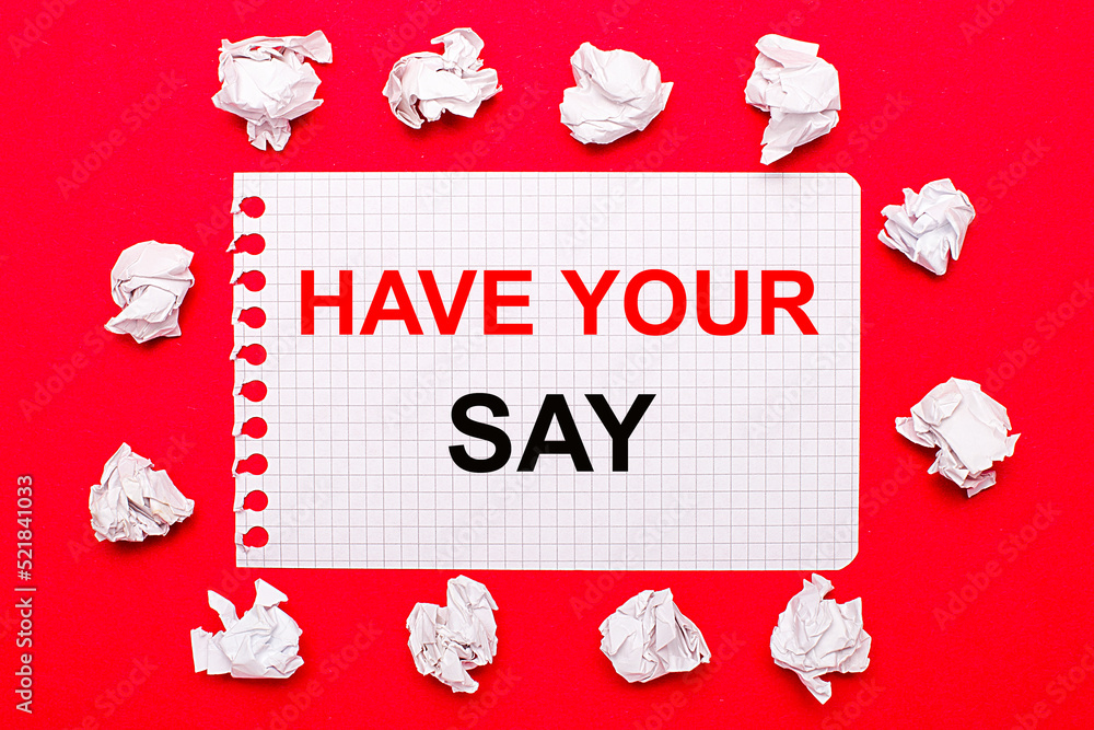 On a bright red background, white crumpled sheets of paper and a sheet ...