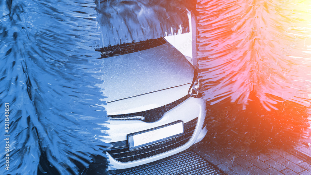 Automatic car wash. Auto brush washer clean blue car on automatic ...