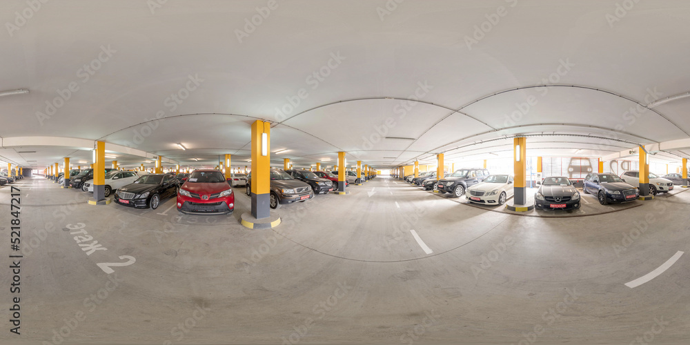 Full spherical seamless hdri panorama 360 degrees angle inside parking garage. Large covered ...