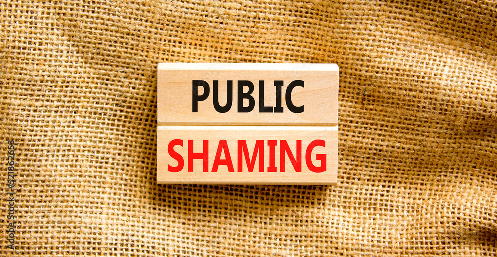 Public shaming symbol. Concept words Public shaming on wooden blocks on ...