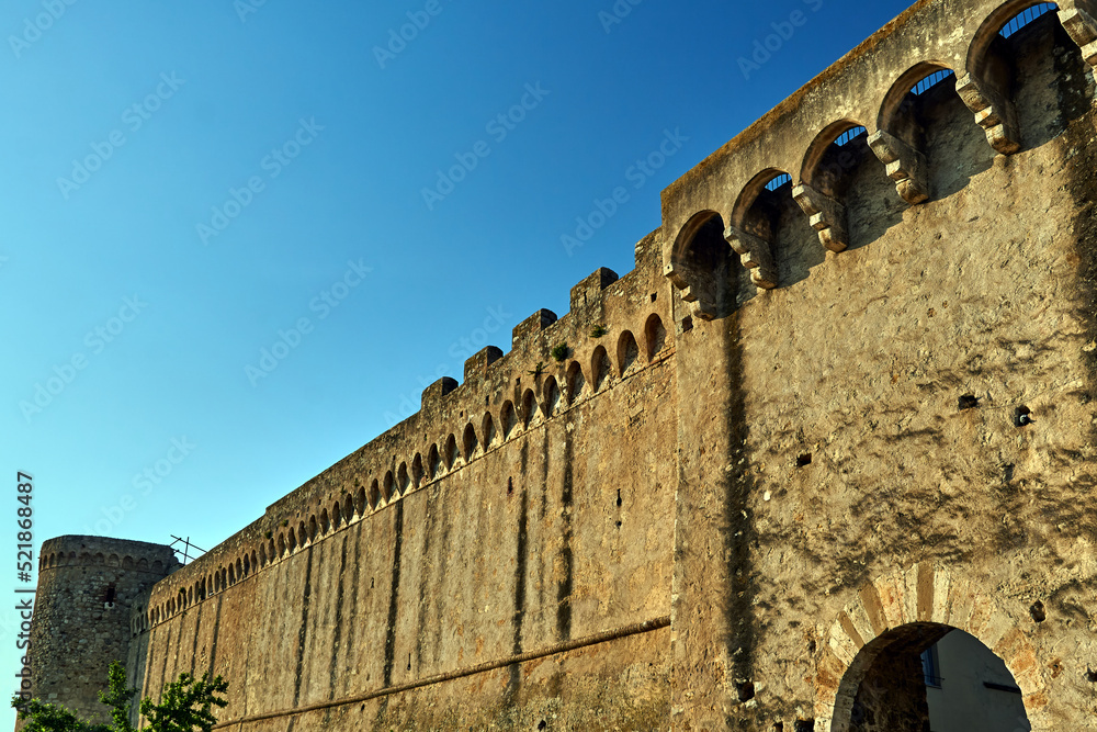 Medieval fortified tower and stone walls in Tuscany Stock Photo | Adobe ...