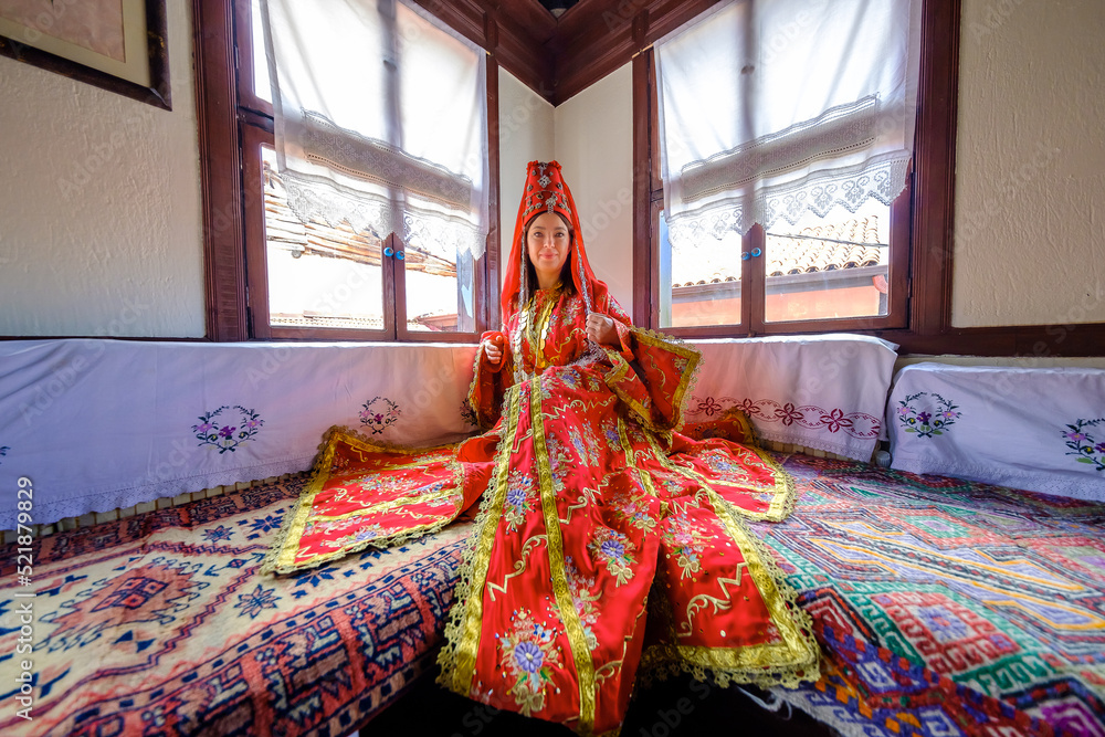 Young lady with her old style turkish traditional costume and headgear ...