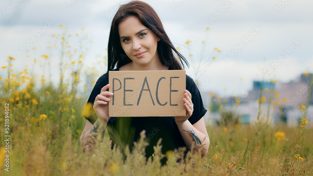 Beautiful female activist caucasian woman girl stands outside flip ...