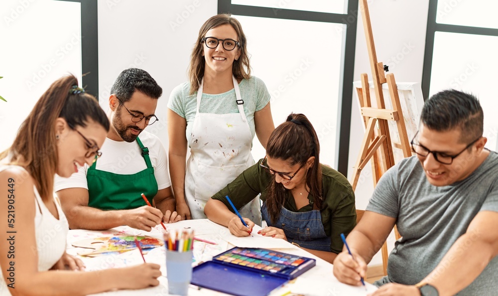 Group of draw students sitting on the table drawing at art studio ...