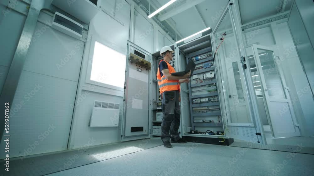 Electrical engineer working check the electric current voltage and ...