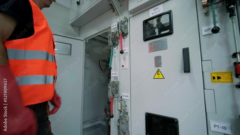 Electrical engineer working check the electric current voltage and ...