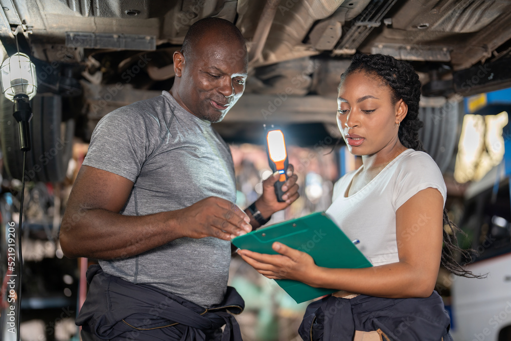 Mechanical girl wearing half overall cover suit hold checklist talking ...