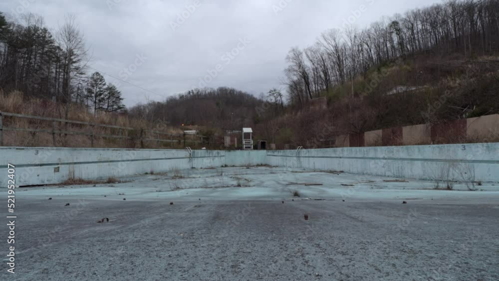 Slider Footage of an Empty Overgrown Wave Pool in an Abandoned Rural ...