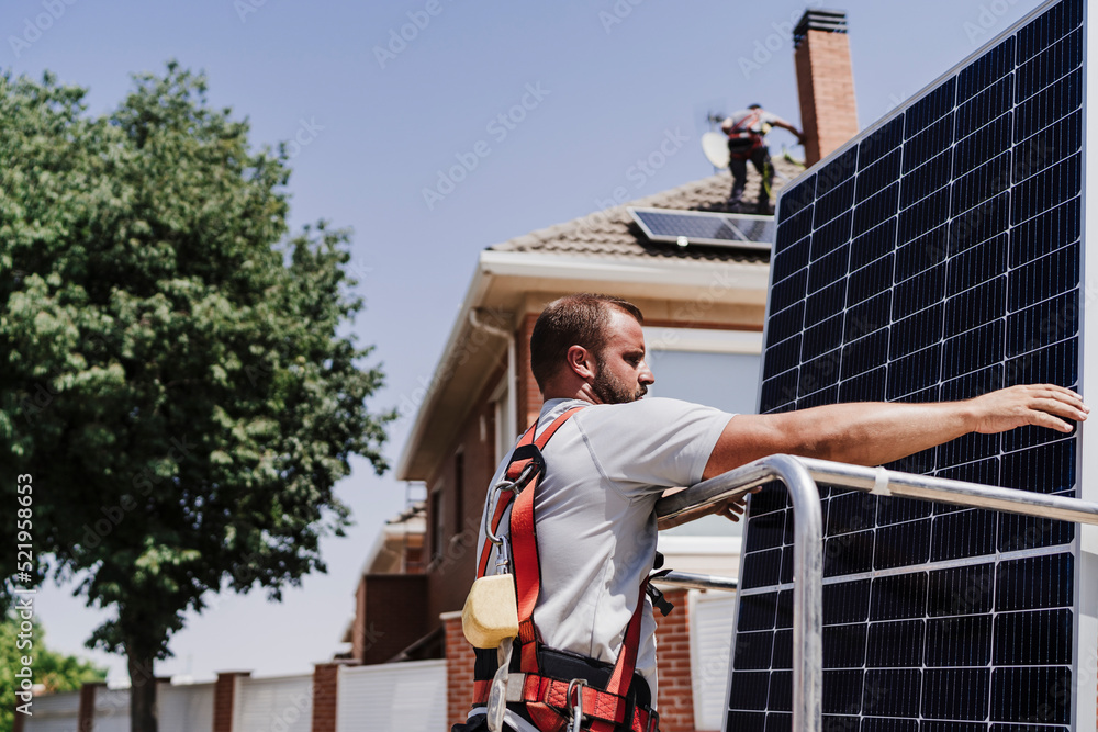 Engineer loading solar panel in hydraulic platform Stock Photo | Adobe ...
