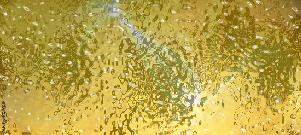 Transparent colored glass. Golden color rippled background. Abstract ...