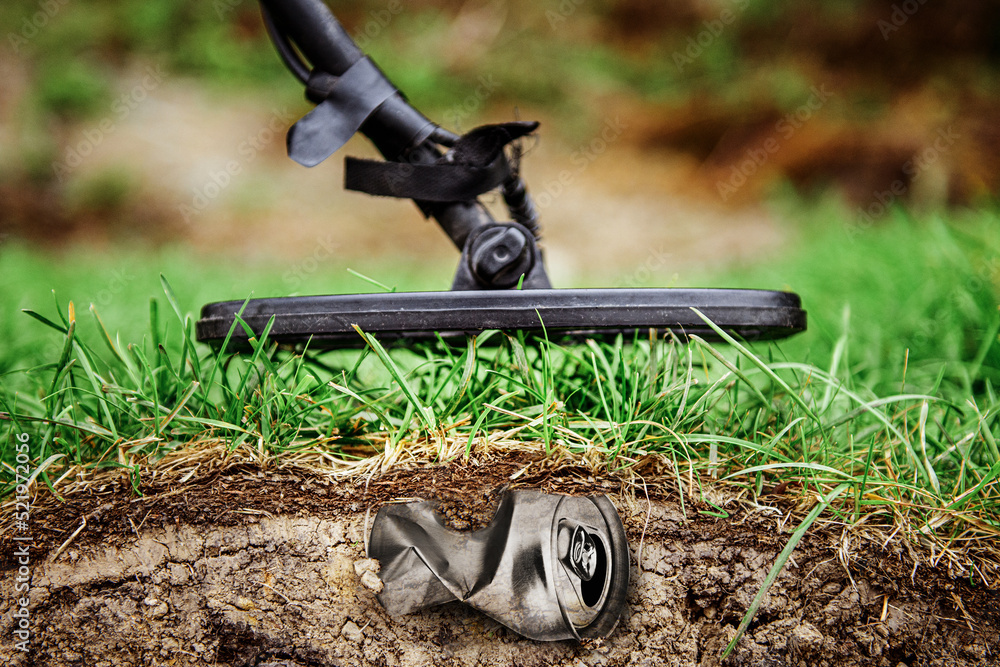 metal detector at work in the forest or field. Search for treasure and ...