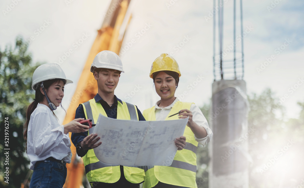 Three experts inspect commercial building construction sites and ...