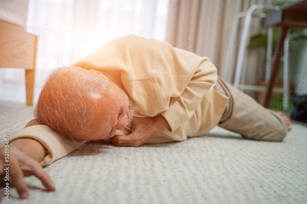 Senior man lying on floor after falling down in bedroom at home,Senior ...