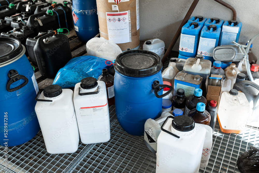 Metal and plastic barrels containing hazardous chemicals from industry ...