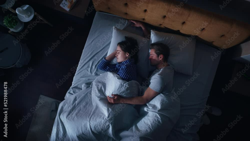 Top View Home: Happy Young Couple Cuddling Together in the Bed Sleeping ...