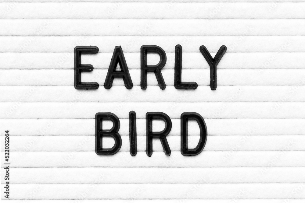 Black color letter in word early bird on white felt board background ...