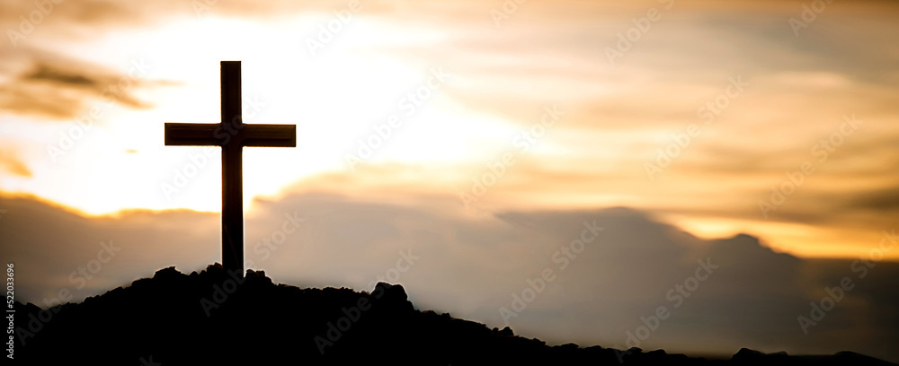 The silhouette cross standing on meadow sunset and flare background ...
