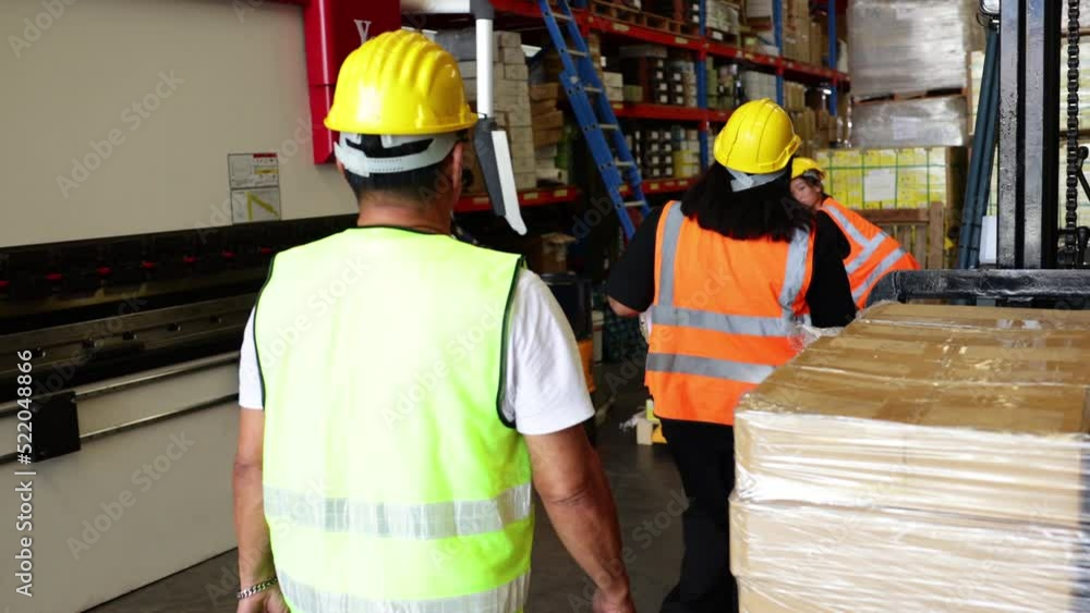 Two women worker carrying and lifting heavy cardboard box. Asian obese ...