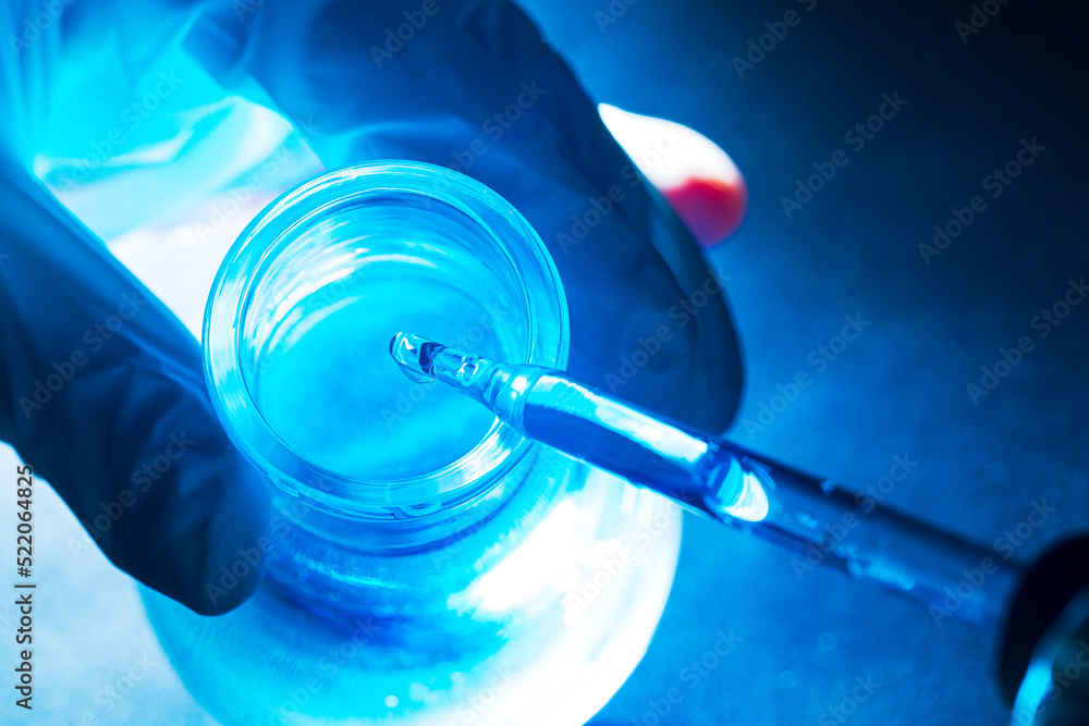 Science blue glass tube experiment,Flask in scientist hand with test ...