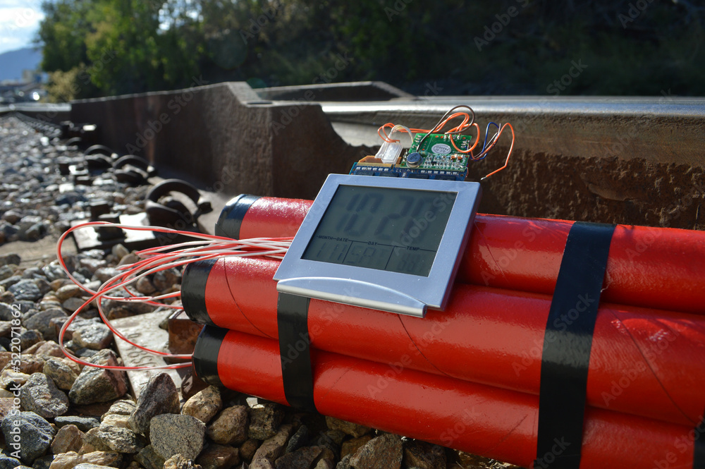 Time bomb made of dynamite, on railroad tracks Stock Photo | Adobe Stock