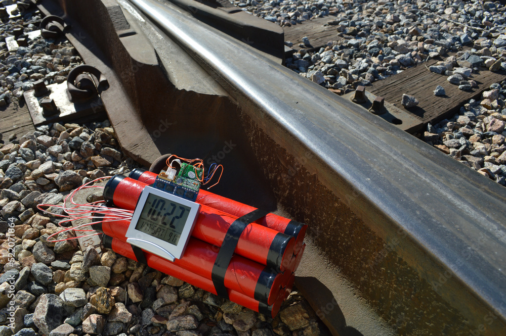 Time bomb made of dynamite, on railroad tracks Stock Photo | Adobe Stock