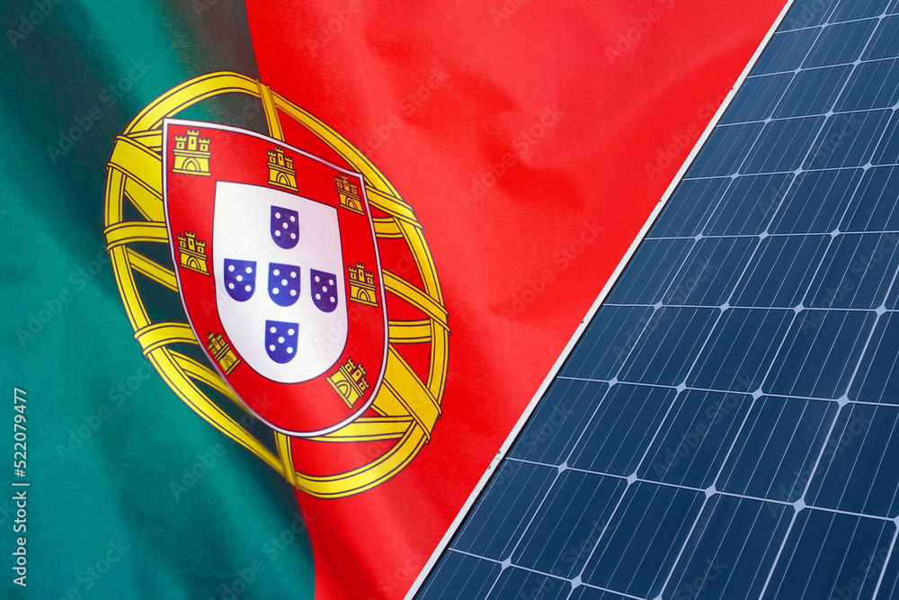 Solar panels against flag Portugal background. Solar battery generates ...