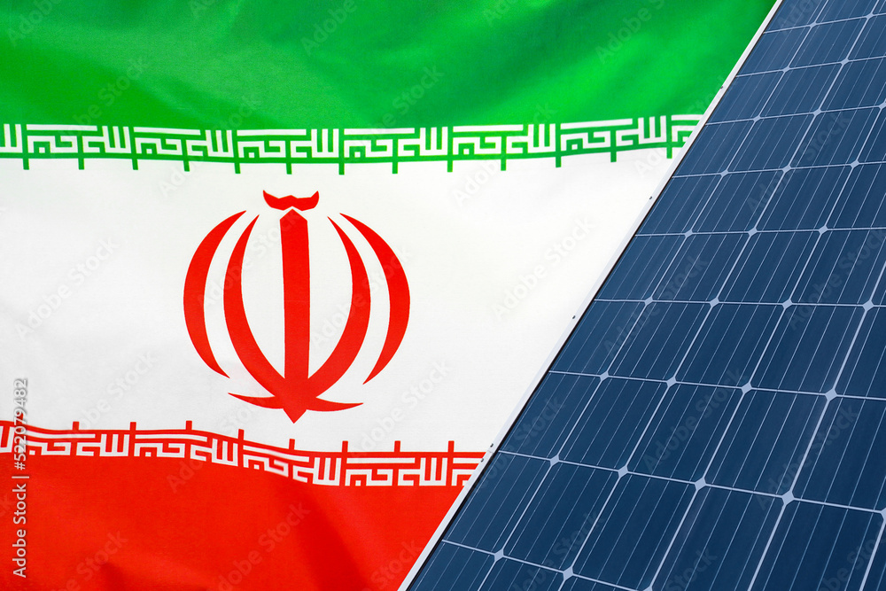 Solar panels against flag Iran background. Solar battery generates a ...